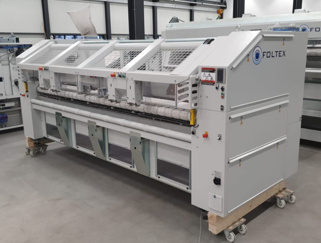 Two Station FOLTEX LP2 large & small-piece feeder - Laundryquip